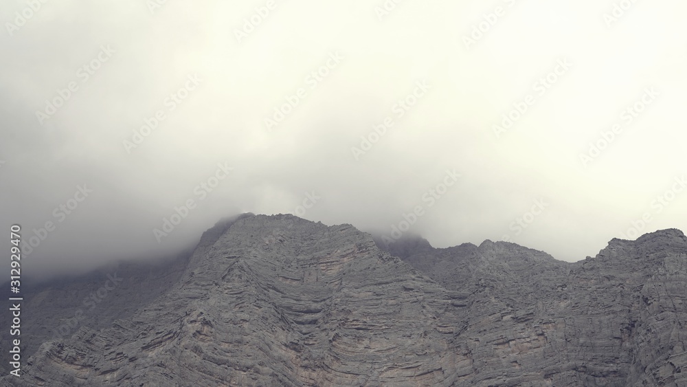 Mountain landscape moving clouds in Ras al Khaimah uae , fog and mist ...