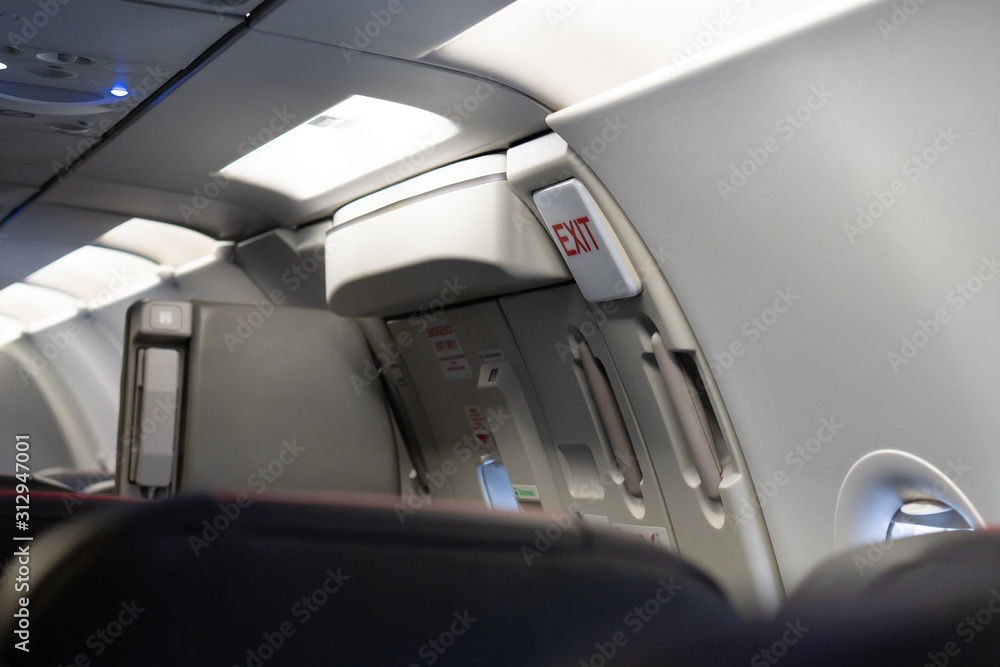 Exit Row Safety sign Red Exit on Airplane Stock Photo | Adobe Stock