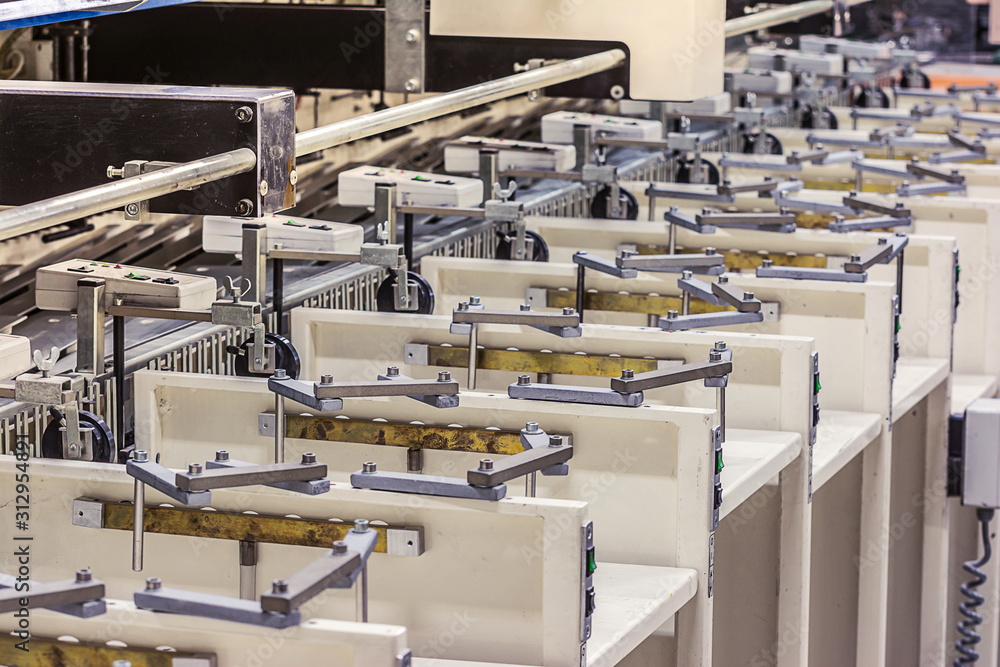 Paper sheet sorting machine in a printing press Stock Photo | Adobe Stock