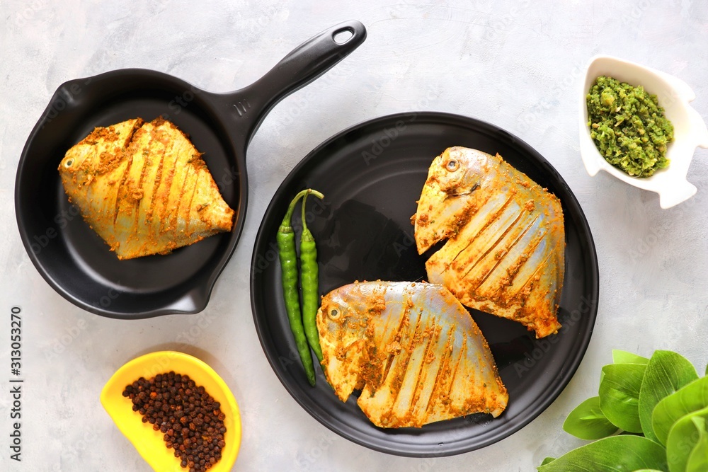 Fresh Marinated Pomfret fish or butter fish is cleaned and ready for ...