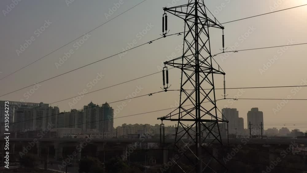 Aerial Drone Footage Of High Voltage Electricity Tower With Urban ...