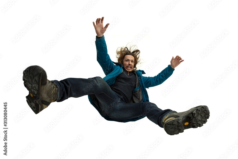 A second before falling. Caucasian young man falling down in moment ...
