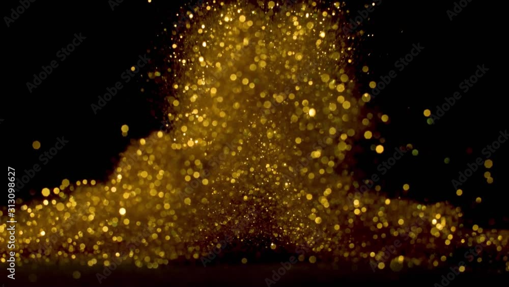 Falling gold glitter particles. Falling shiny confetti with magic ...