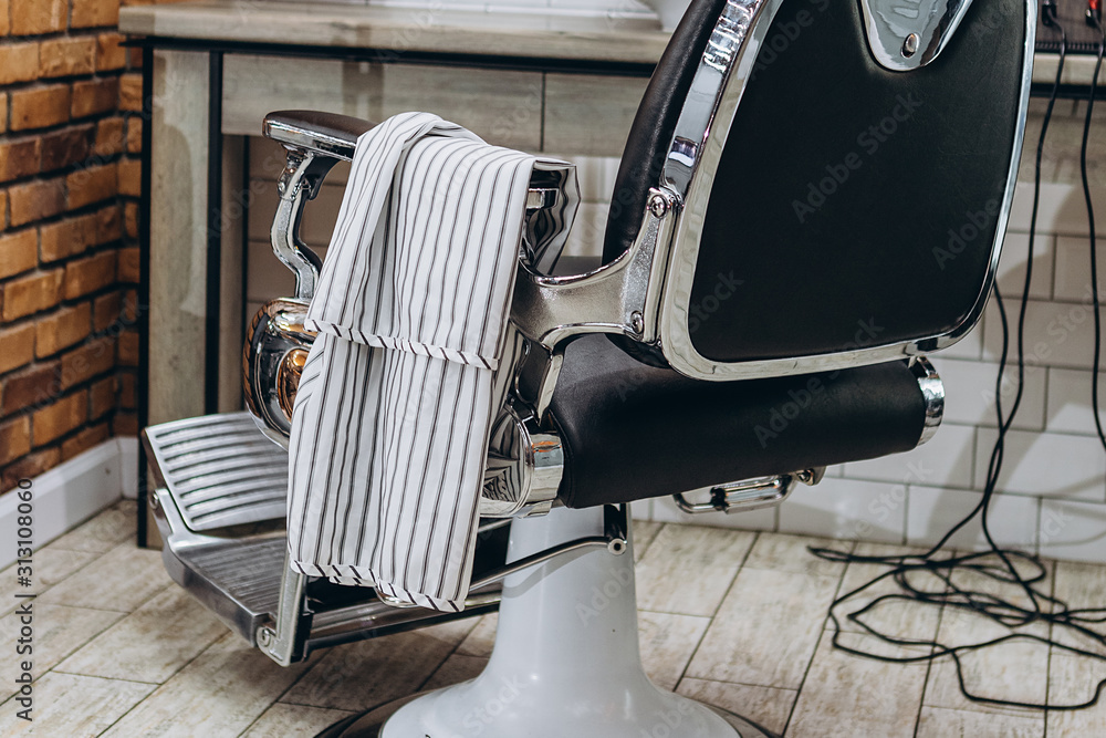 the interior of a modern hair salon for men where hairdressers work ...