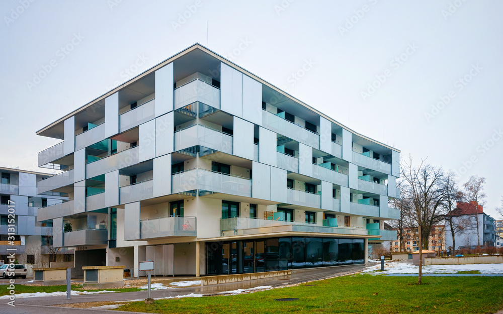 Apartment in residential building exterior. Housing structure at blue ...