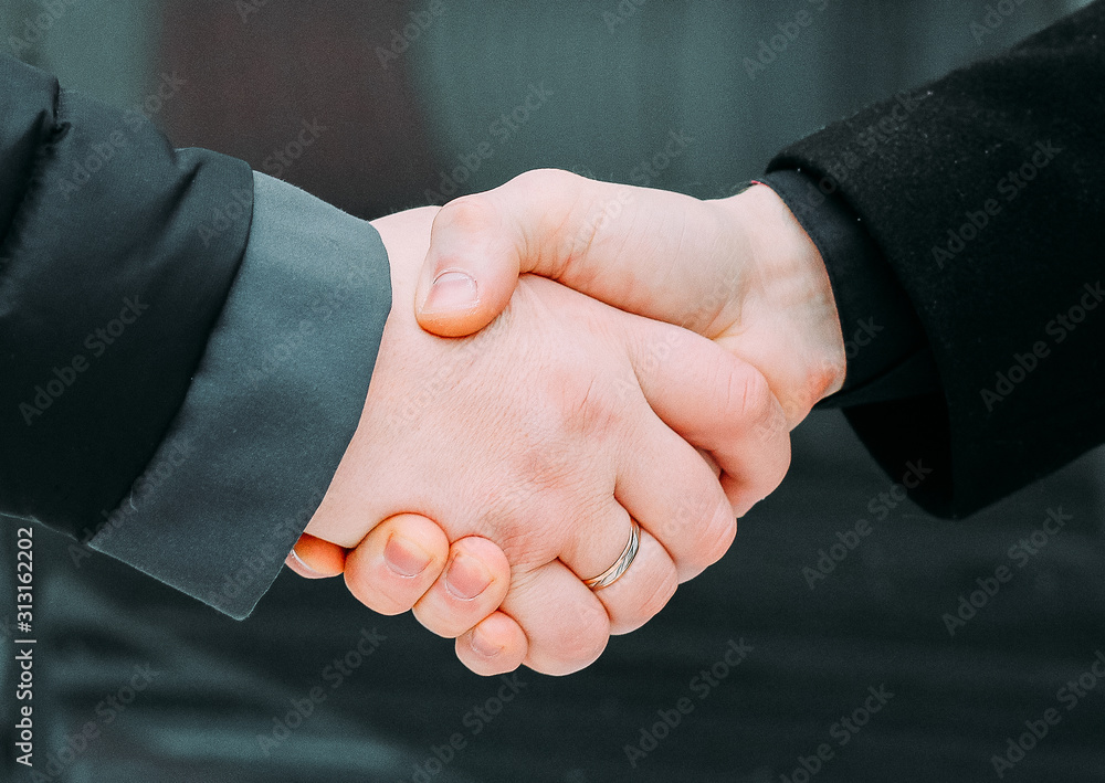 strong male handshake at the end of the transaction Stock Photo | Adobe ...