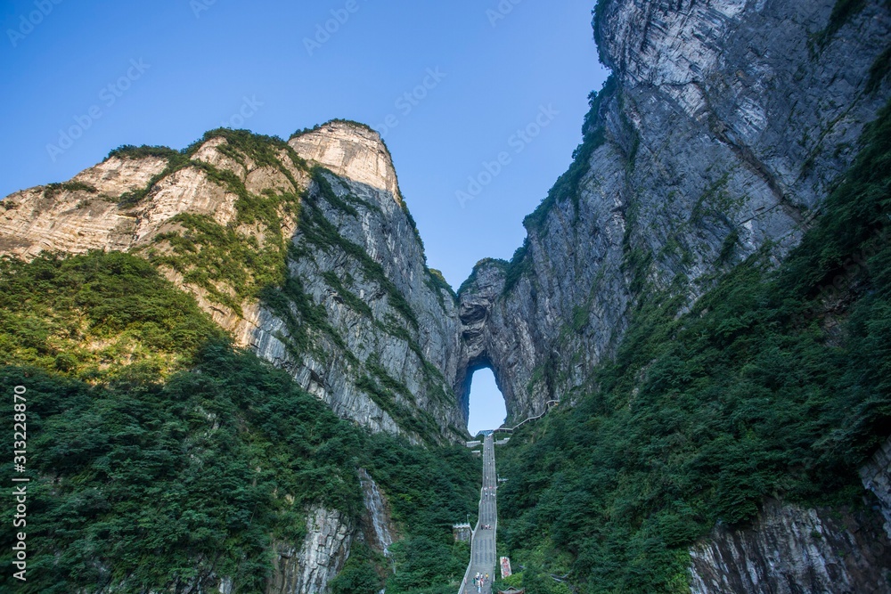 Tianmen Mountain Known as The Heaven`s Gate surrounded by the green ...