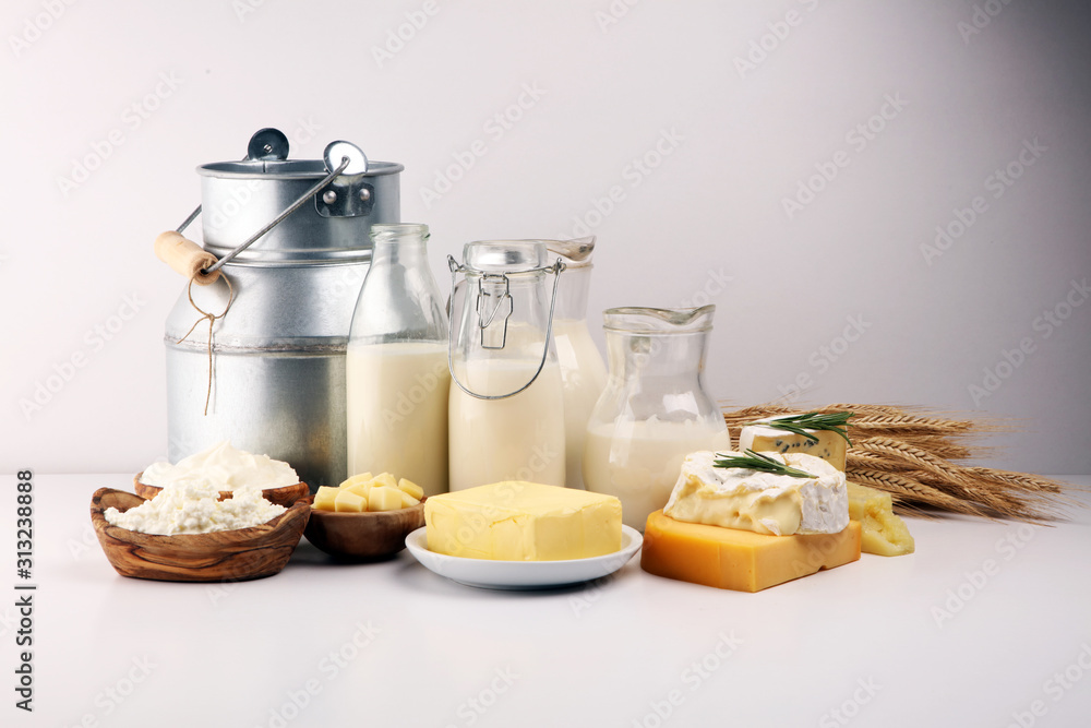 Different healthy dairy products on rustic background with milk, cheese ...