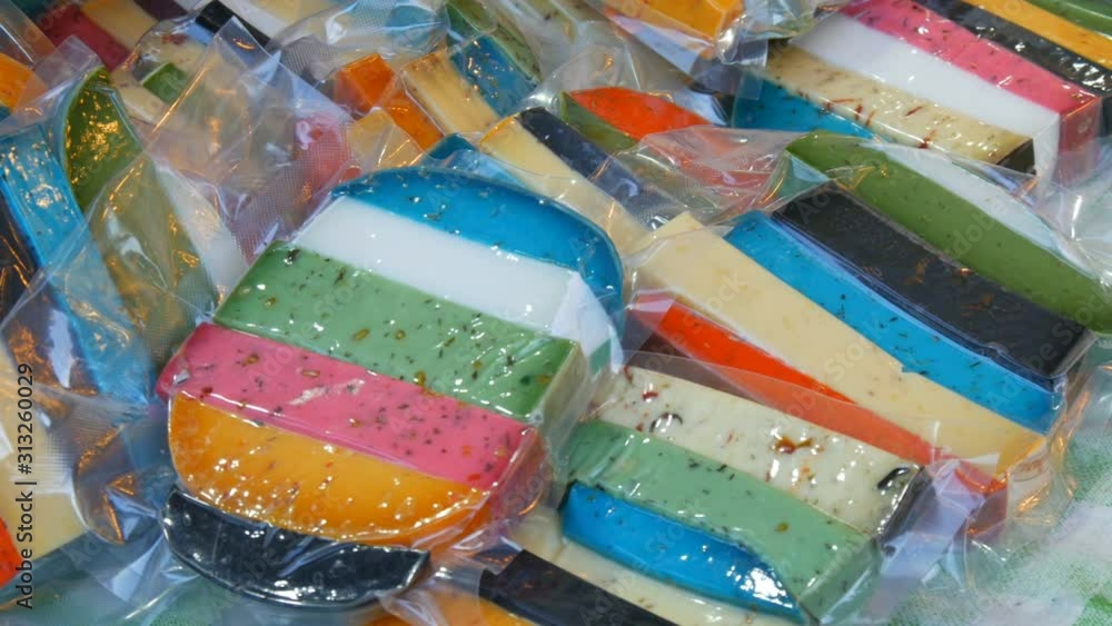 Interesting multi-colored hard cow and goat cheese of various tastes at ...