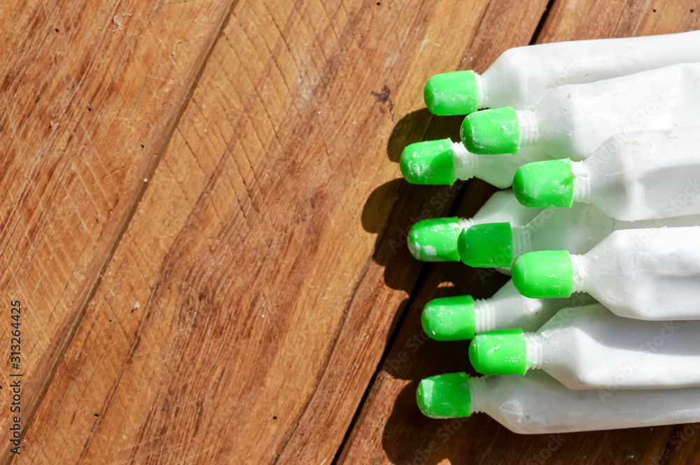 calcium chuna tube,calcium powder tube in wooden table,Paan Wala Chuna ...