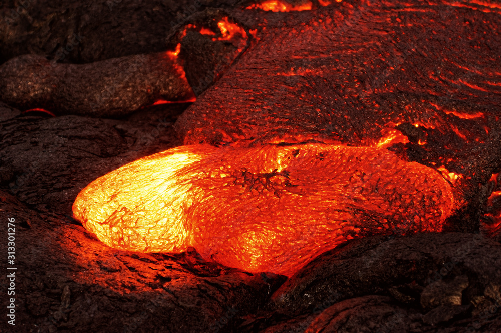 Foto de Detailed view of an active lava flow, hot magma emerges from a ...