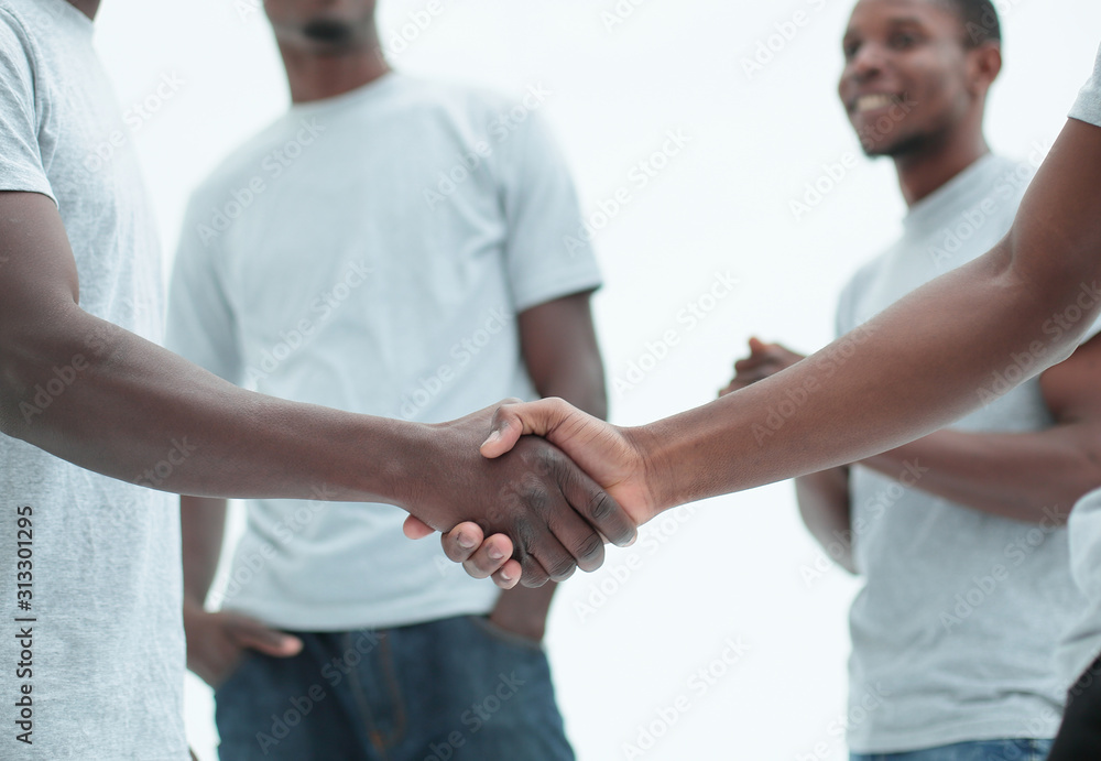 smiling guys shaking hands. isolated on white Stock Photo | Adobe Stock