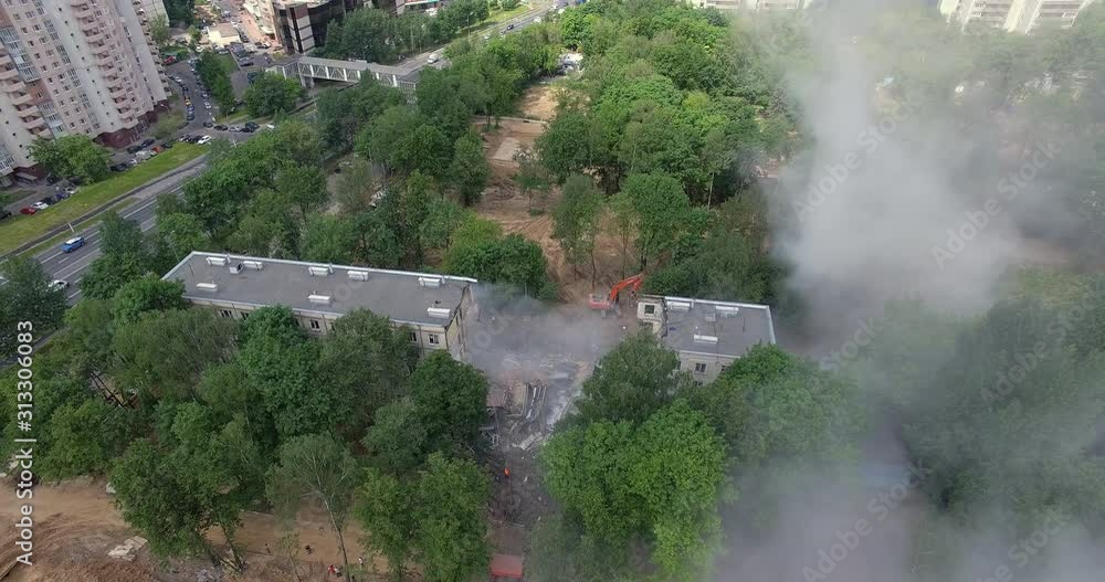 An aerial view of a multi storey residential building being demolished ...