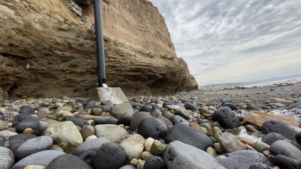 A fish factory throws waste into the water. Waste pipe. Playa Tres Emes ...