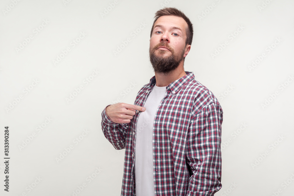 This is me! Portrait of smug arrogant bearded man in casual plaid shirt ...