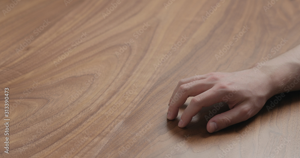man hand finger tapping on black walnut table Stock Photo | Adobe Stock