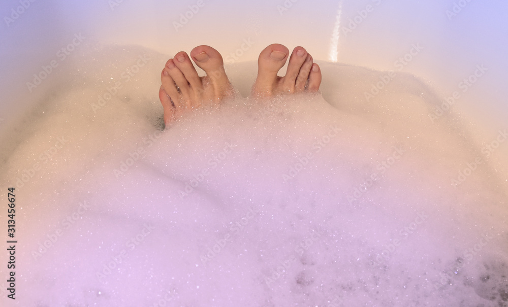 Feet in the bathtub stock images. Bath with foam images. Colored bath ...
