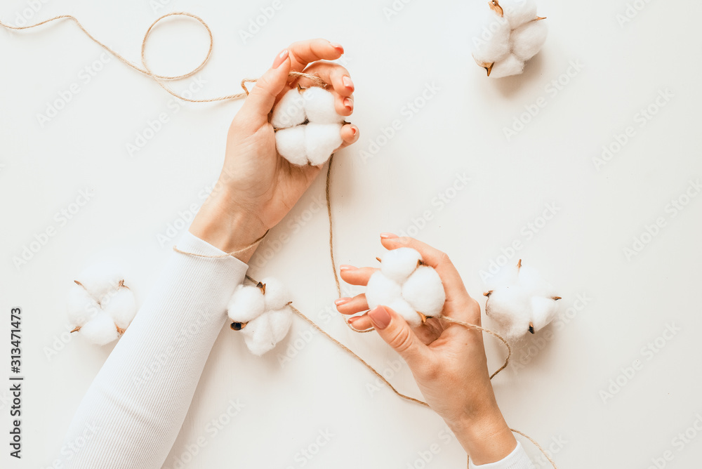 Girl's hand on a white background with the colors of the cotton ...