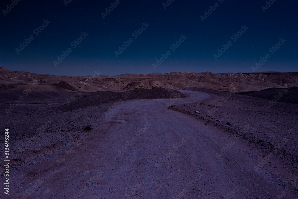 long exposure desert night scenery landscape with stars blue sky ...