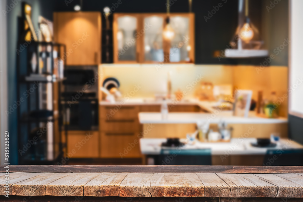 Wood table with blur kitchen room background .For montage product ...