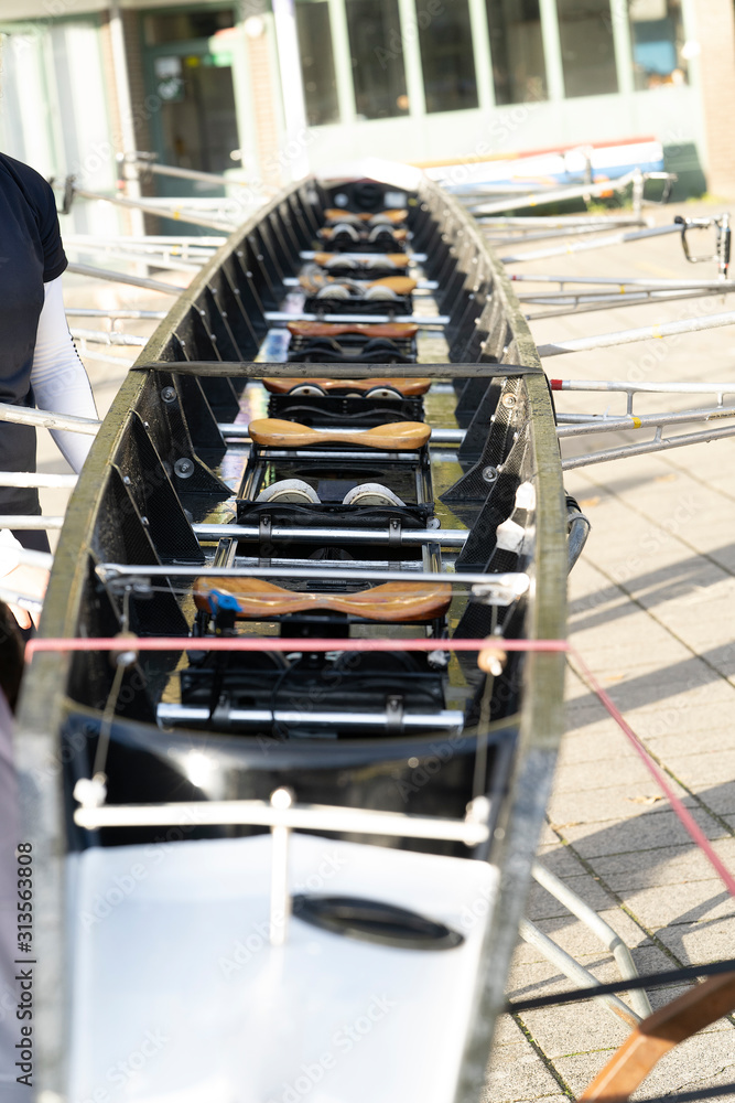 Look inside a professional carbon fiber rowing boat with seats and ...
