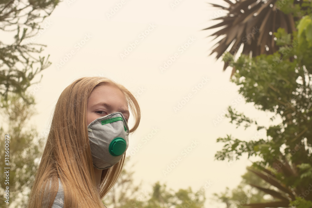 Australian bushfire: blond caucasian girl wearing P2 N95 protection ...