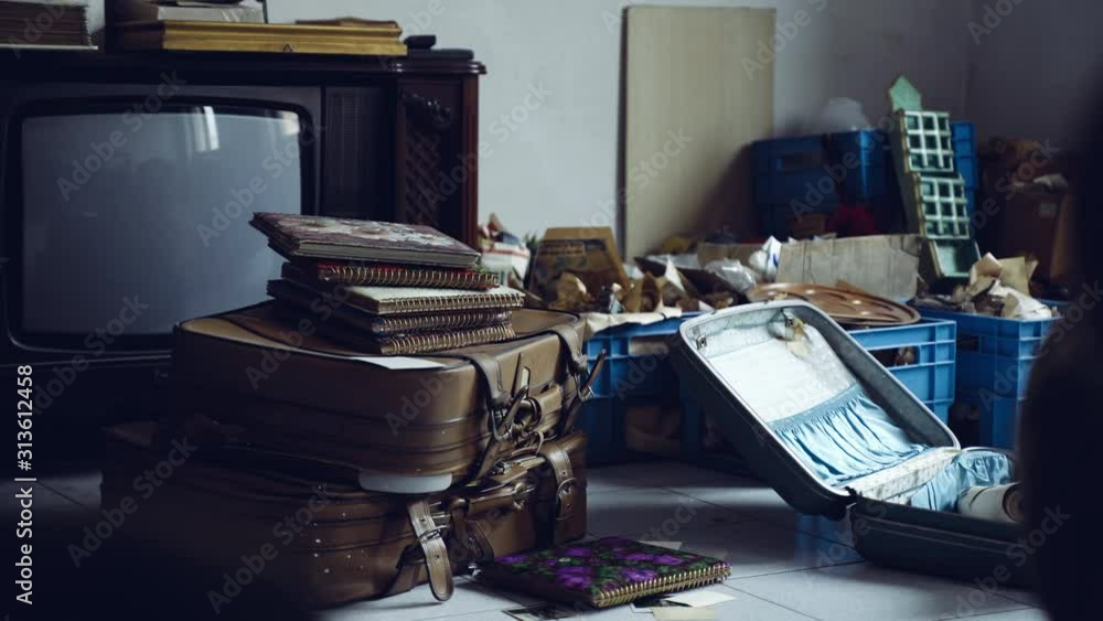 Cold empty abandoned room with retro furniture and wrapped boxes, old ...