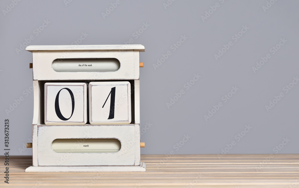 Desktop wooden retro calendar with day number 1. Calendar template for ...