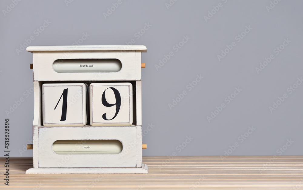 Desktop wooden retro calendar with day number 19. Calendar template for ...