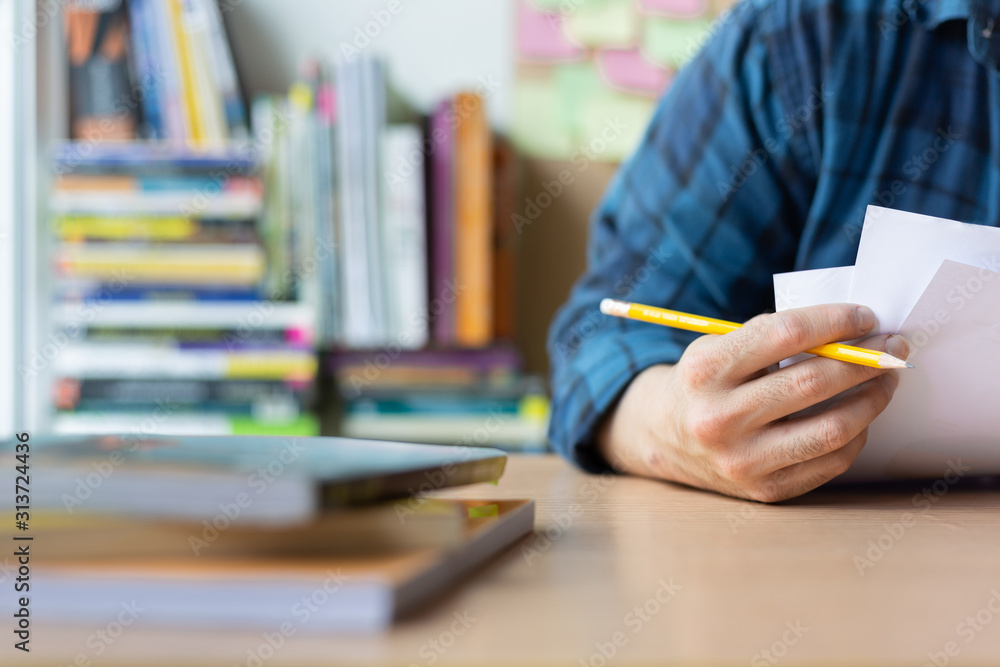 high school,university student study.hands holding pencil writing paper ...