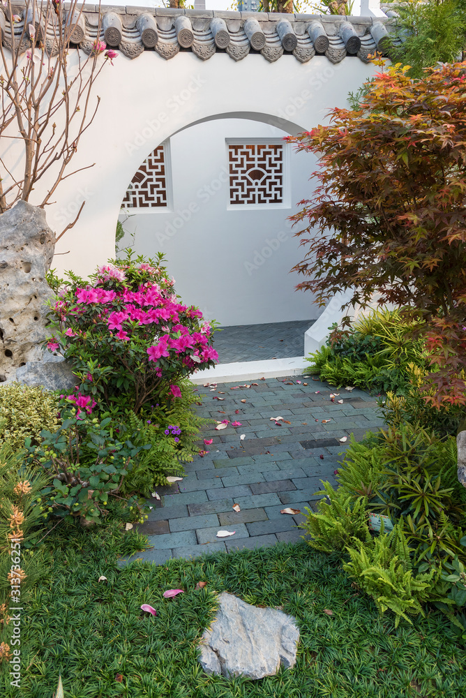 A Moon Gate is a circular opening in a garden wall that acts as a ...