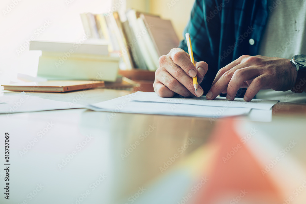 Foto de high school,college,university student writing in classroom or ...