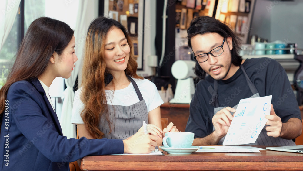 Young asian business woman discussing about financial planning with ...