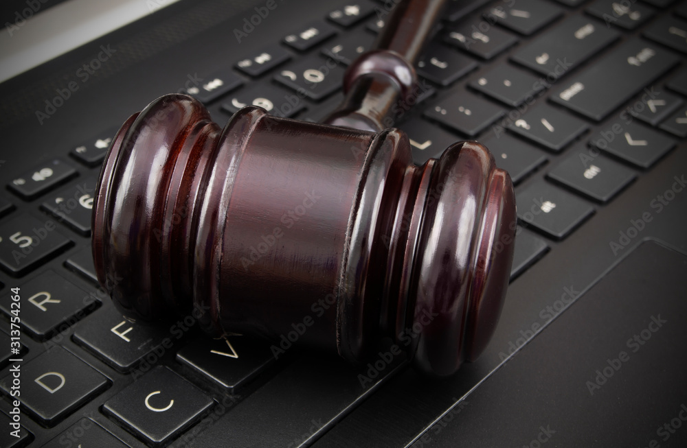 Gavel on laptop computer, cyber law concept Stock Photo | Adobe Stock