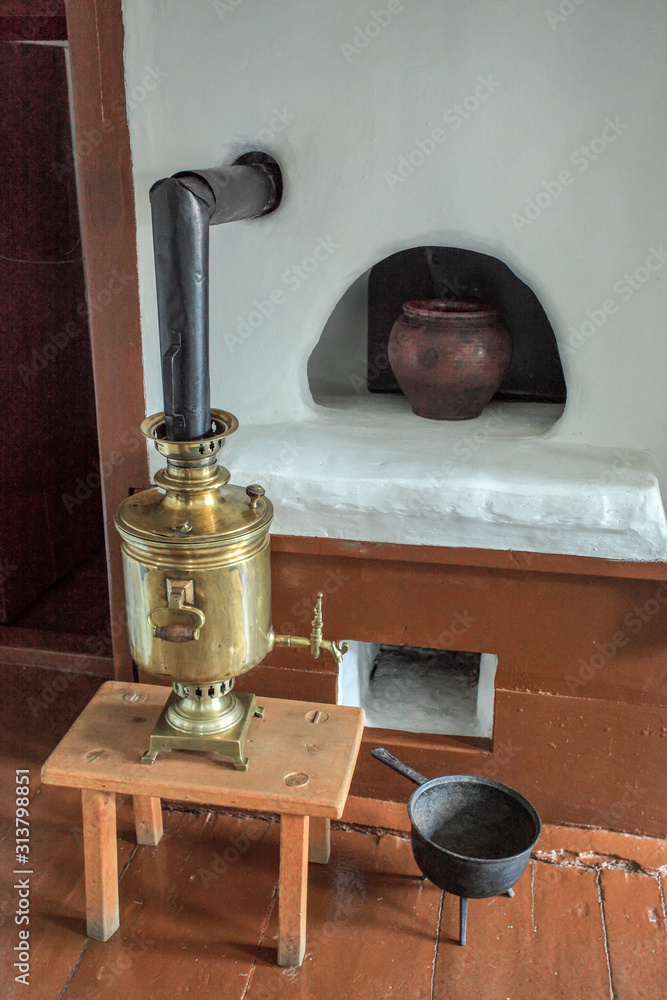 Old russian samovar and old russian stove Stock Photo | Adobe Stock