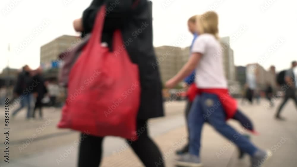 Defocused view of busy public square with people passing by Stock Video ...