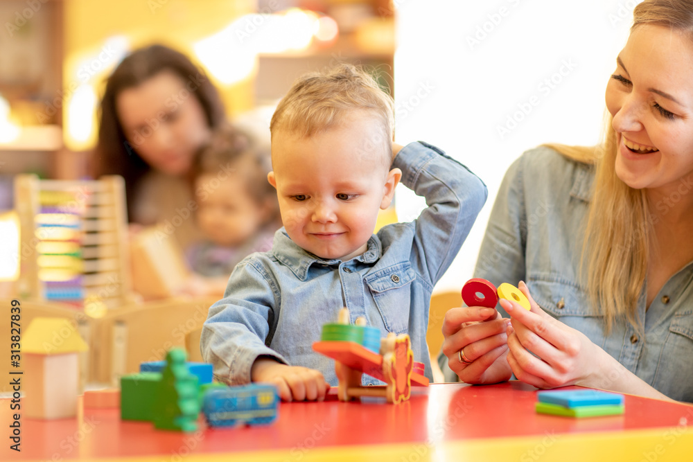 Children kids play with educational toys, arranging and sorting colors ...