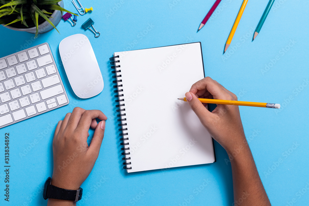 Girl hand drawing blank paper, Top View office desk with computer and ...