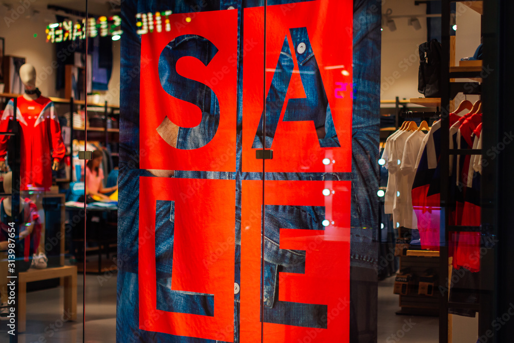 Storefronts with sale sign behind the glass window Stock Photo | Adobe ...