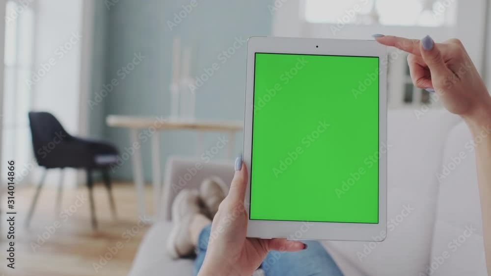 Greenscreen or Chroma Key Tracking. Girl lying on Sofa with Mobile ...