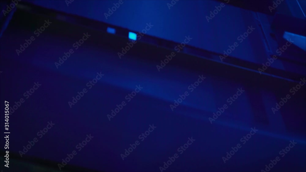 Elevator in a nightclub. Glass elevator with blue backlight. Modern ...