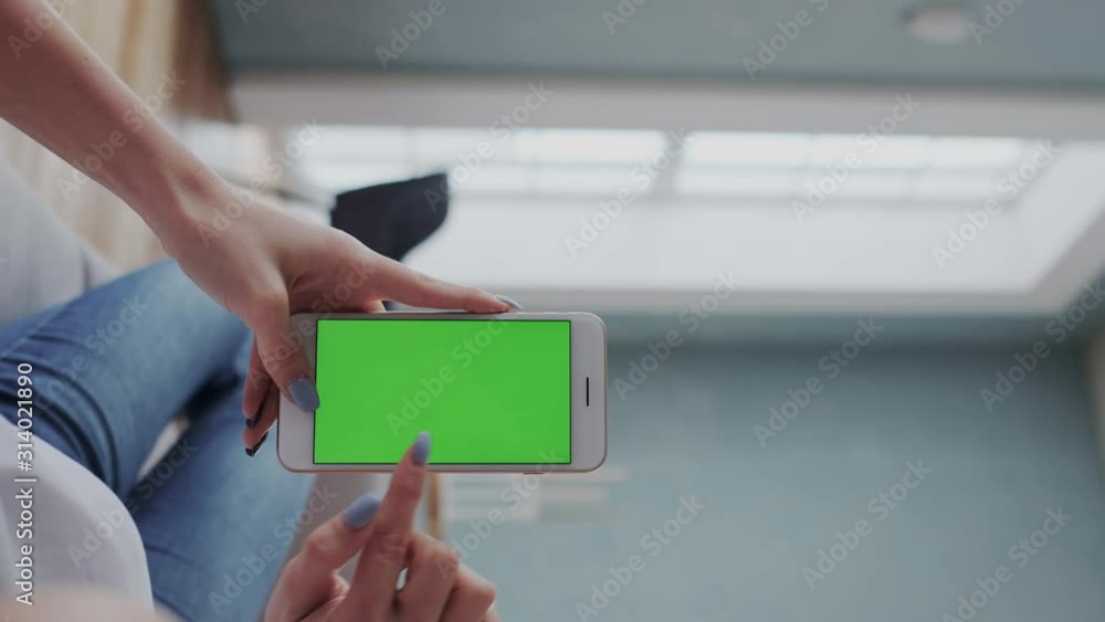 Wideo Stock: Vertical video in POV. Hands with Green Screen. Colour ...