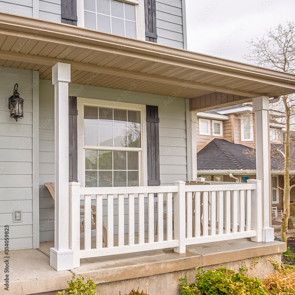 Square Exterior of home with glass panels on front door and stairs ...