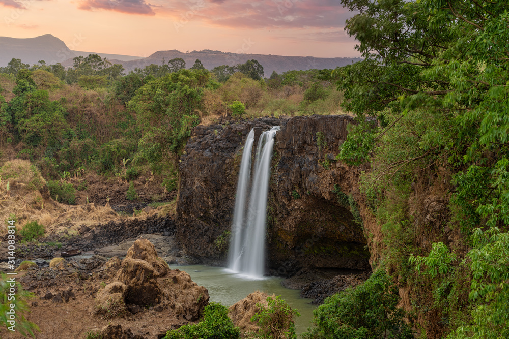 sunset on Blue Nile waterfall in dry season with low water flow near ...