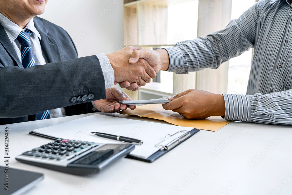 Bribery and corruption concept, bribe in the form of dollar bills ...