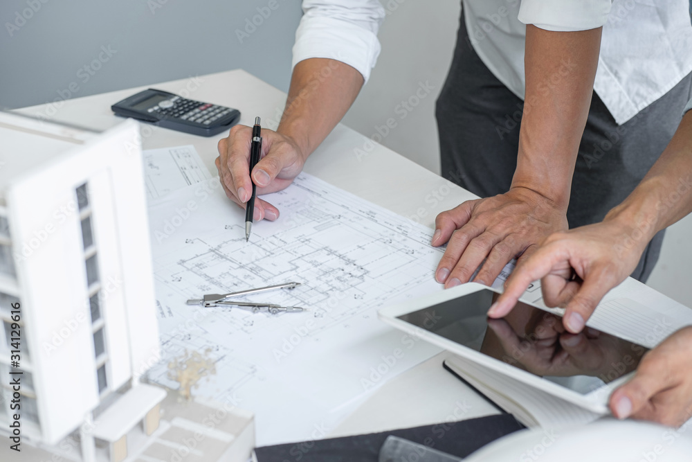 Architecture Engineer Teamwork Meeting, Drawing and working for ...