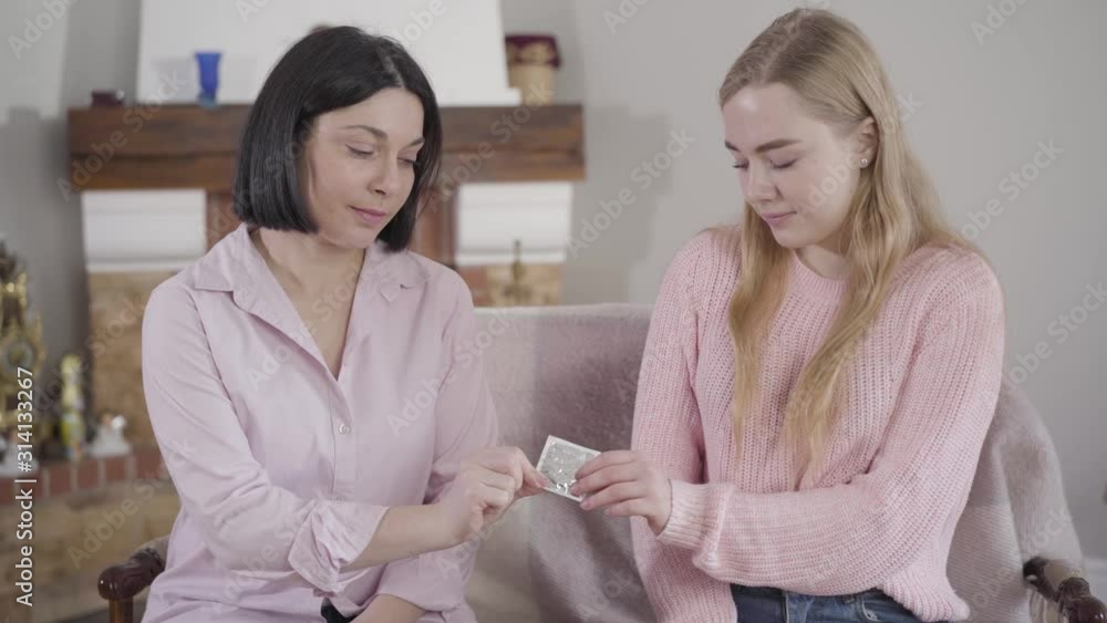 Young Brunette Caucasian Mother Giving Her Teenage Daughter Condom 2617