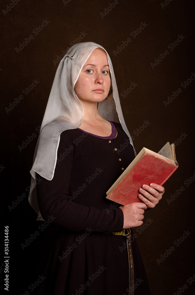 Beautiful sophisticated girl actress in a medieval costume of the 14th ...