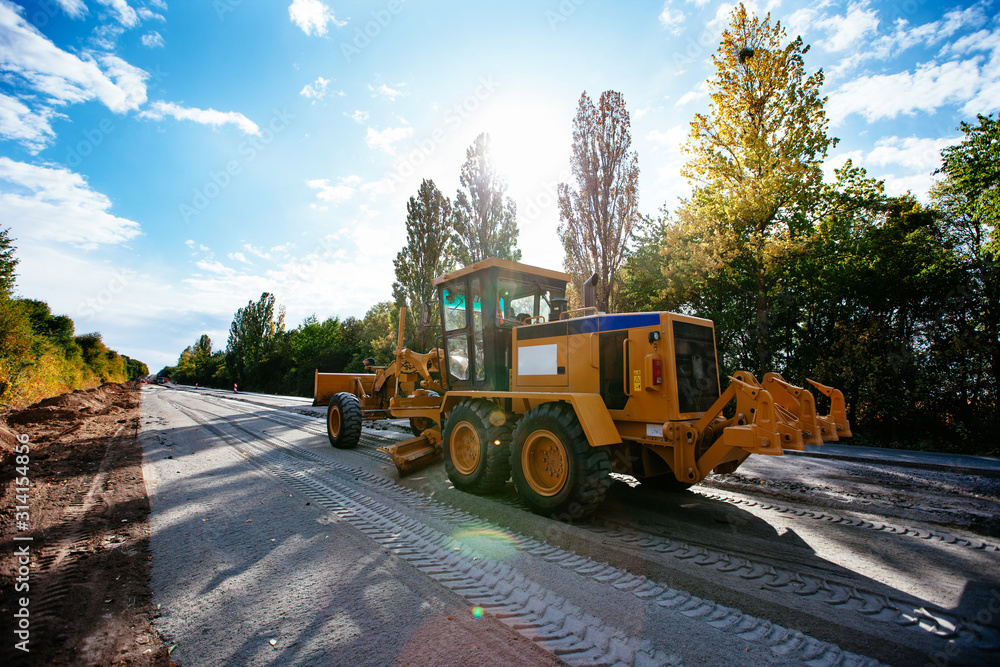 Auto grader construction and road markings Stock Photo | Adobe Stock