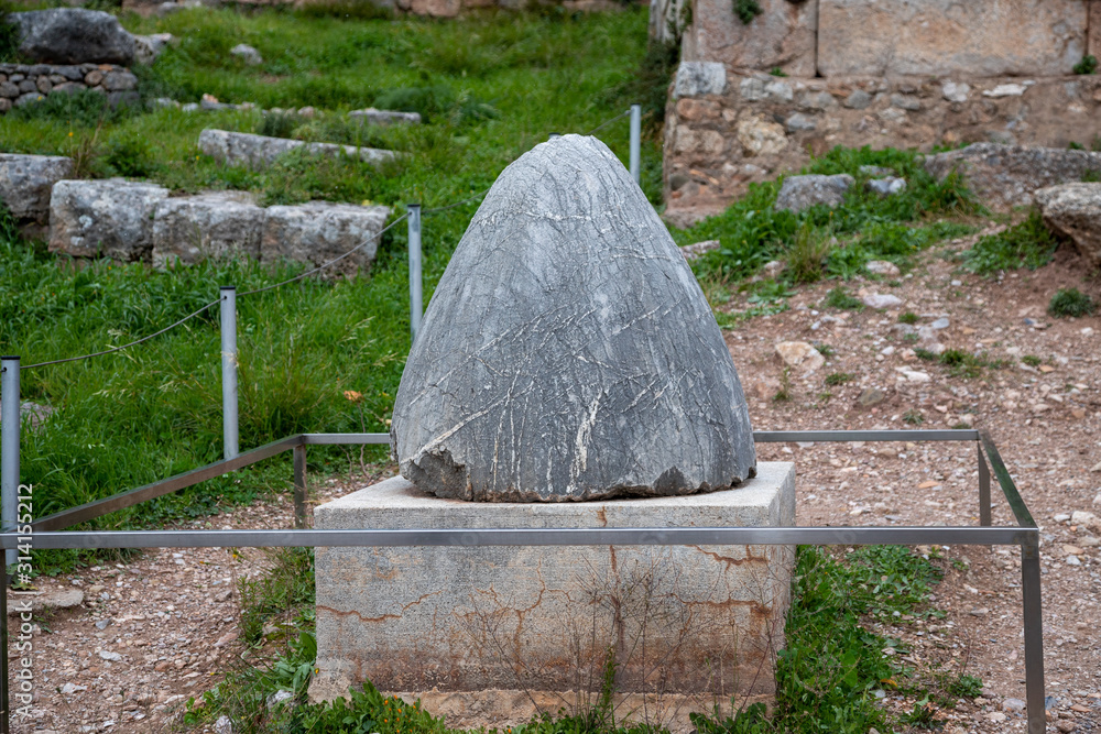 The omphalos stone, navel of the World, archaeological site of Delphi ...